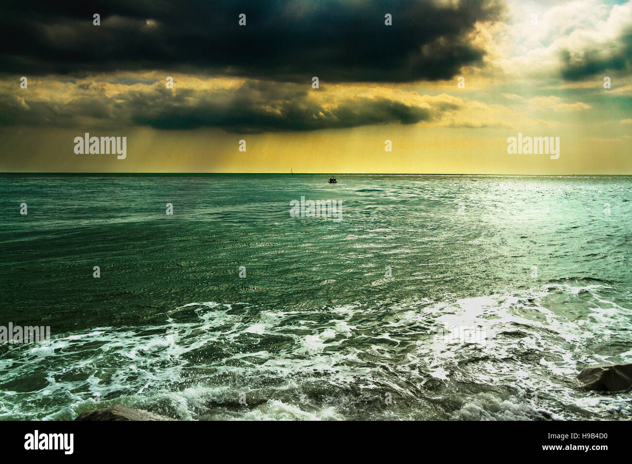 Sun rays through storm clouds hi-res stock photography and images - Alamy