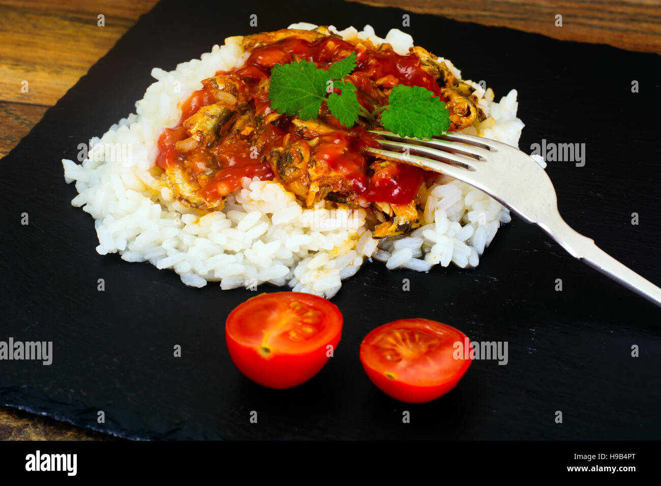 Rice with Canned Fish in Tomato Sauce Studio Photo Stock Photo - Alamy