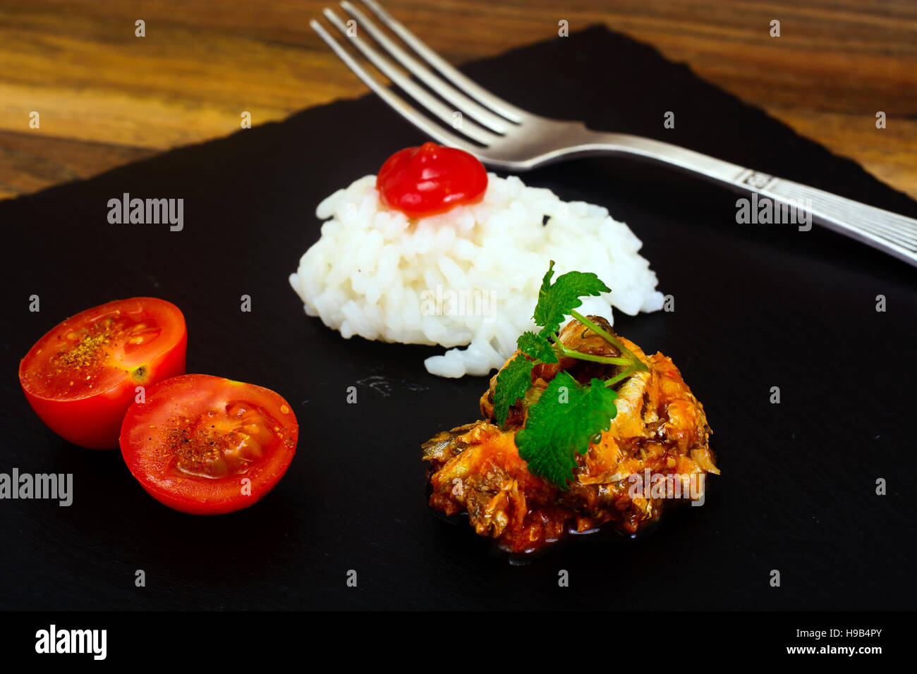 Rice with Canned Fish in Tomato Sauce Studio Photo Stock Photo - Alamy