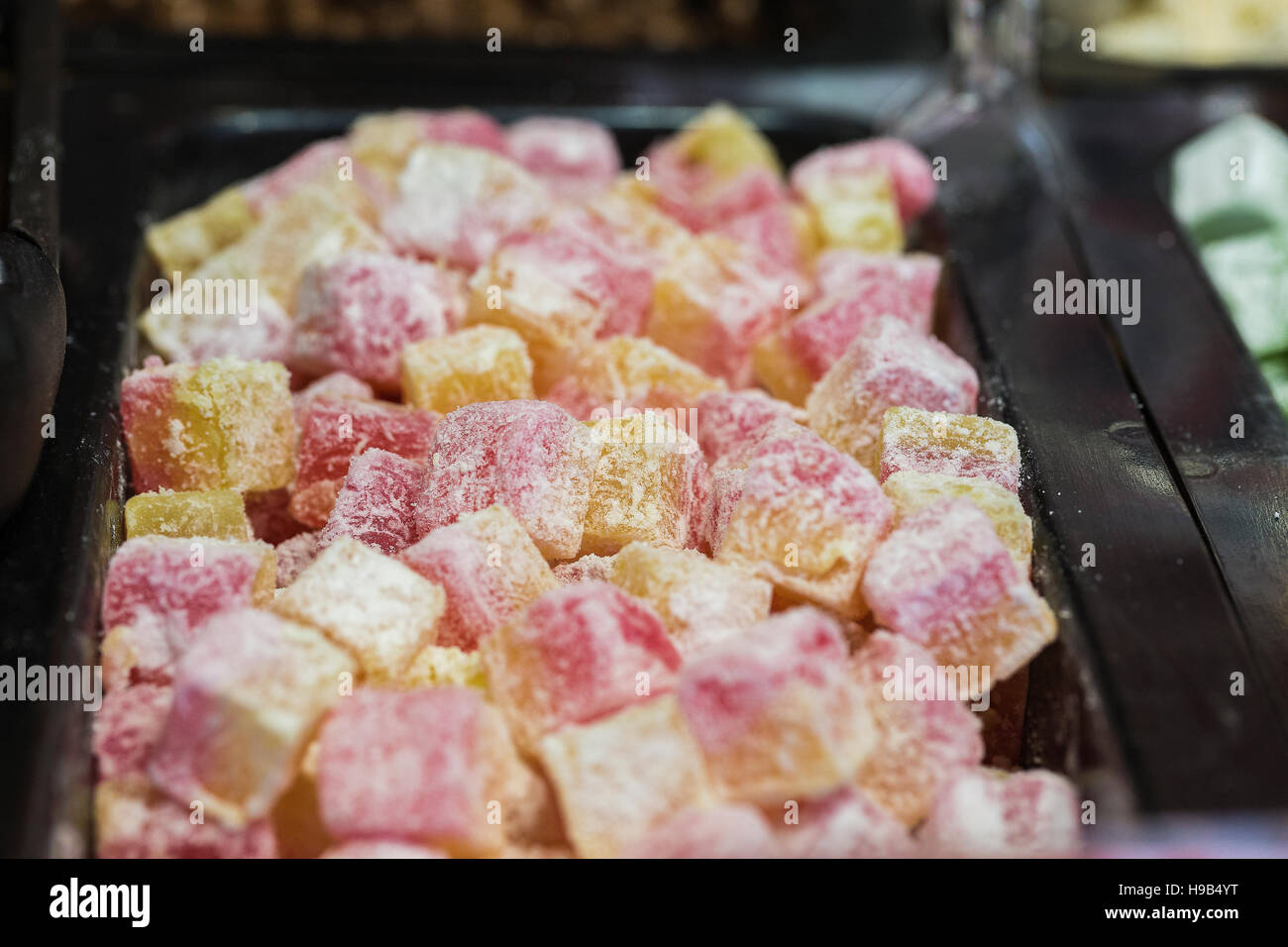 Yellow and red Turkish delight in tray at artisanal Christmas market ...