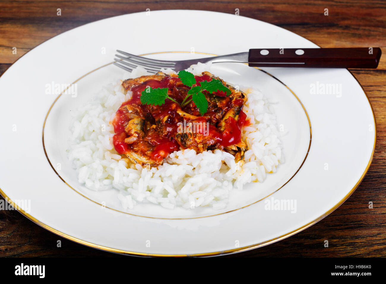 Rice with Canned Fish in Tomato Sauce Studio Photo Stock Photo - Alamy