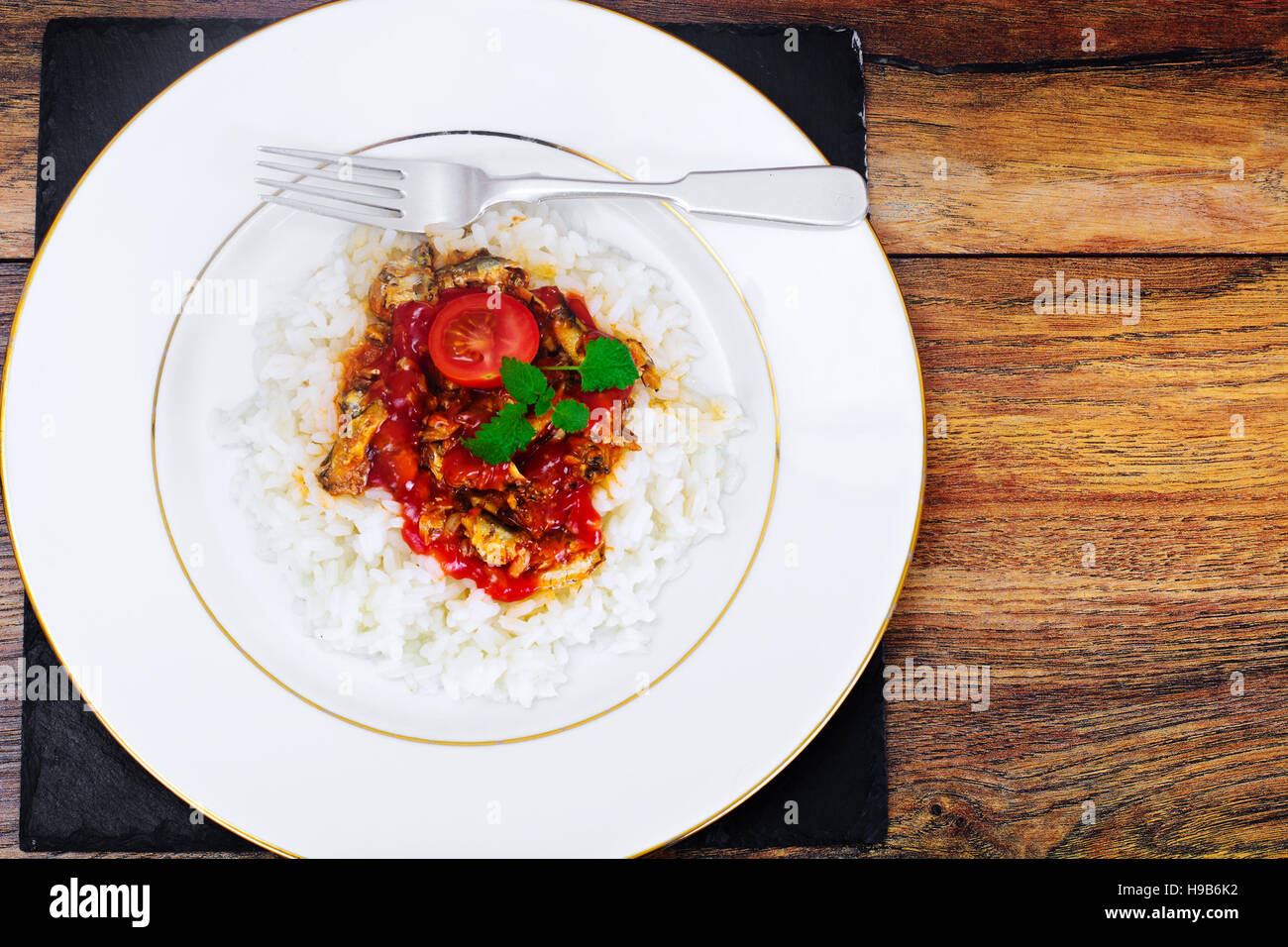 Rice with Canned Fish in Tomato Sauce Studio Photo Stock Photo - Alamy