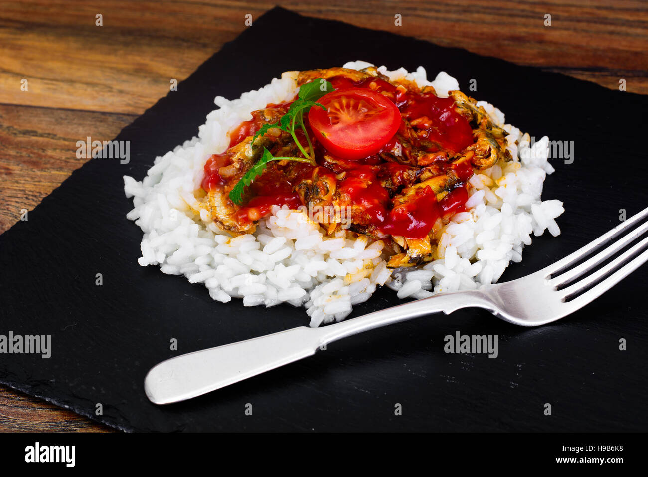 Rice with Canned Fish in Tomato Sauce Studio Photo Stock Photo - Alamy