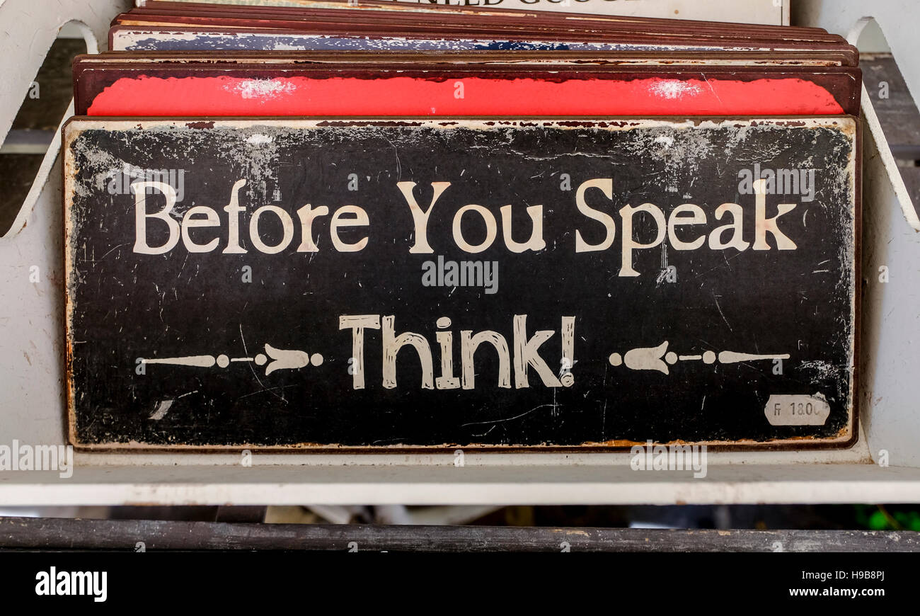 English quote on a metal sign, Before you speak, Think Stock Photo - Alamy
