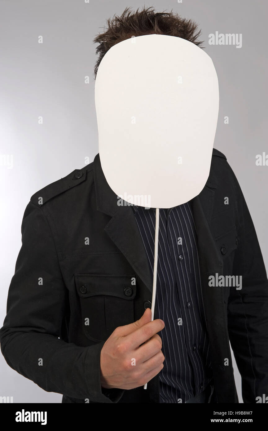 Young man holding blank shield in front of his face Stock Photo - Alamy