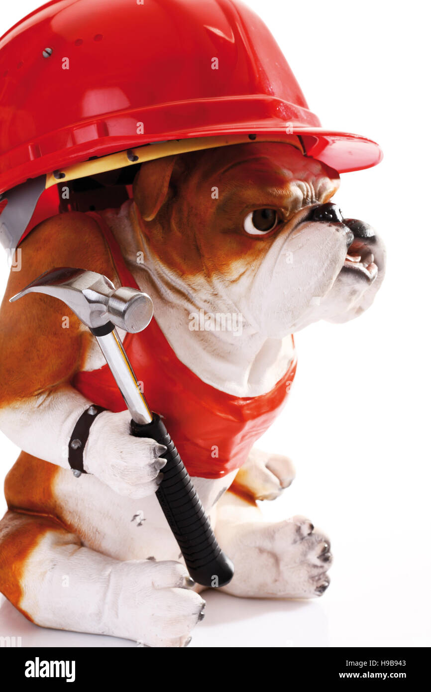 Bulldog figurine wearing a red construction helmet and holding a hammer ...