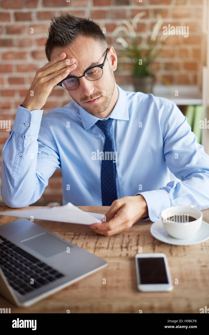 Checking important documents in the office Stock Photo - Alamy
