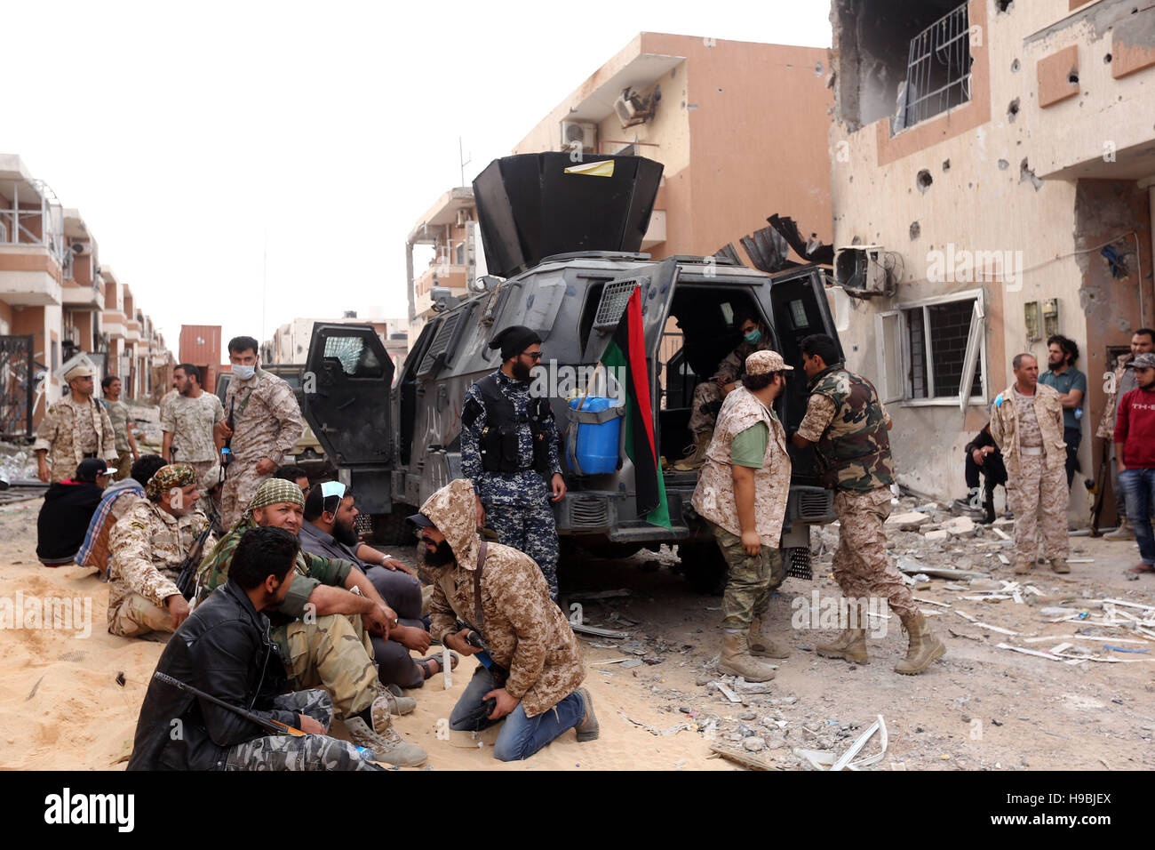 Sirte, Libya. 21st Nov, 2016. Members of the forces loyal to Libya's ...