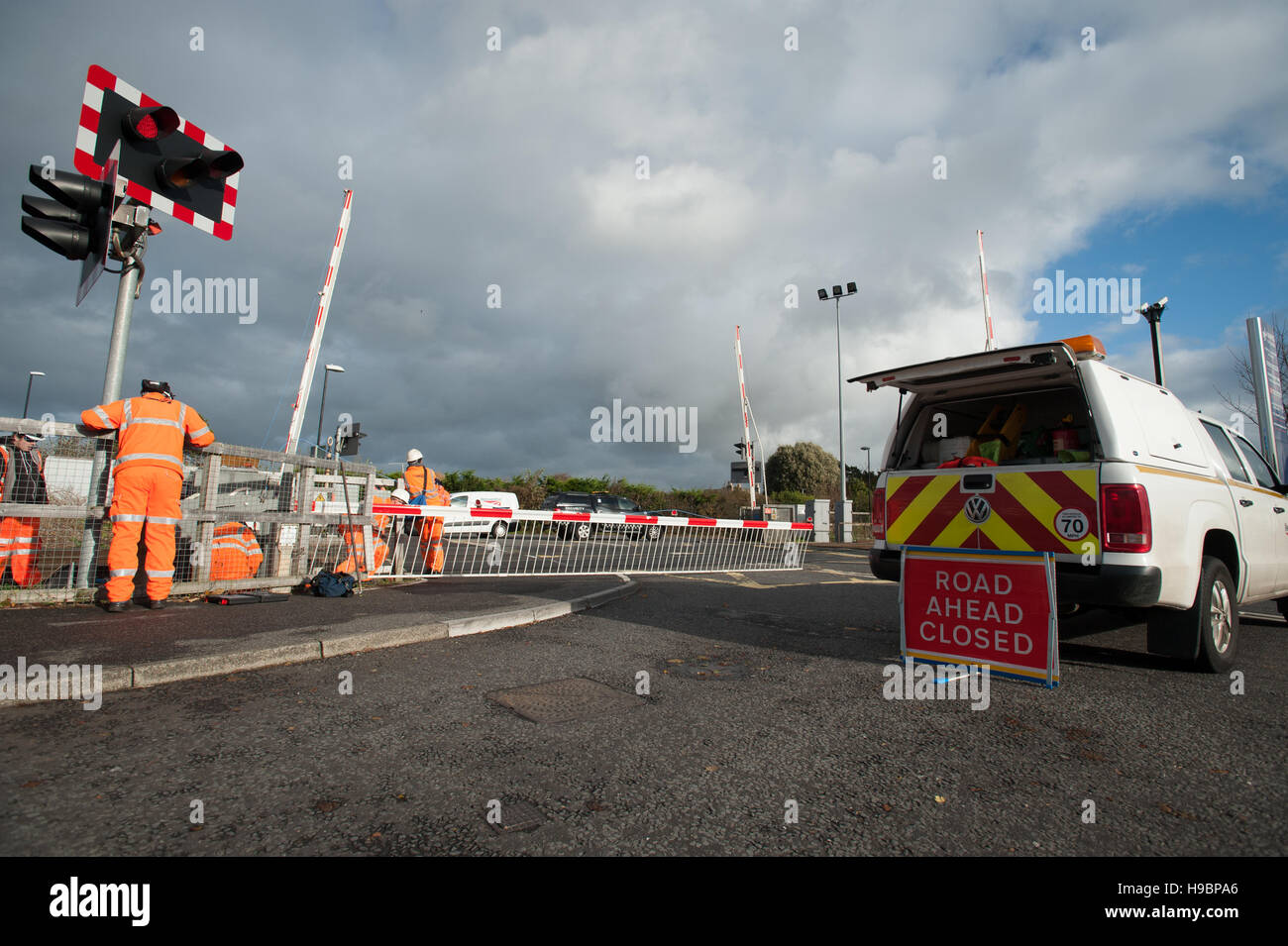 Network Rail engineers repair a railway level crossing barrier after ...