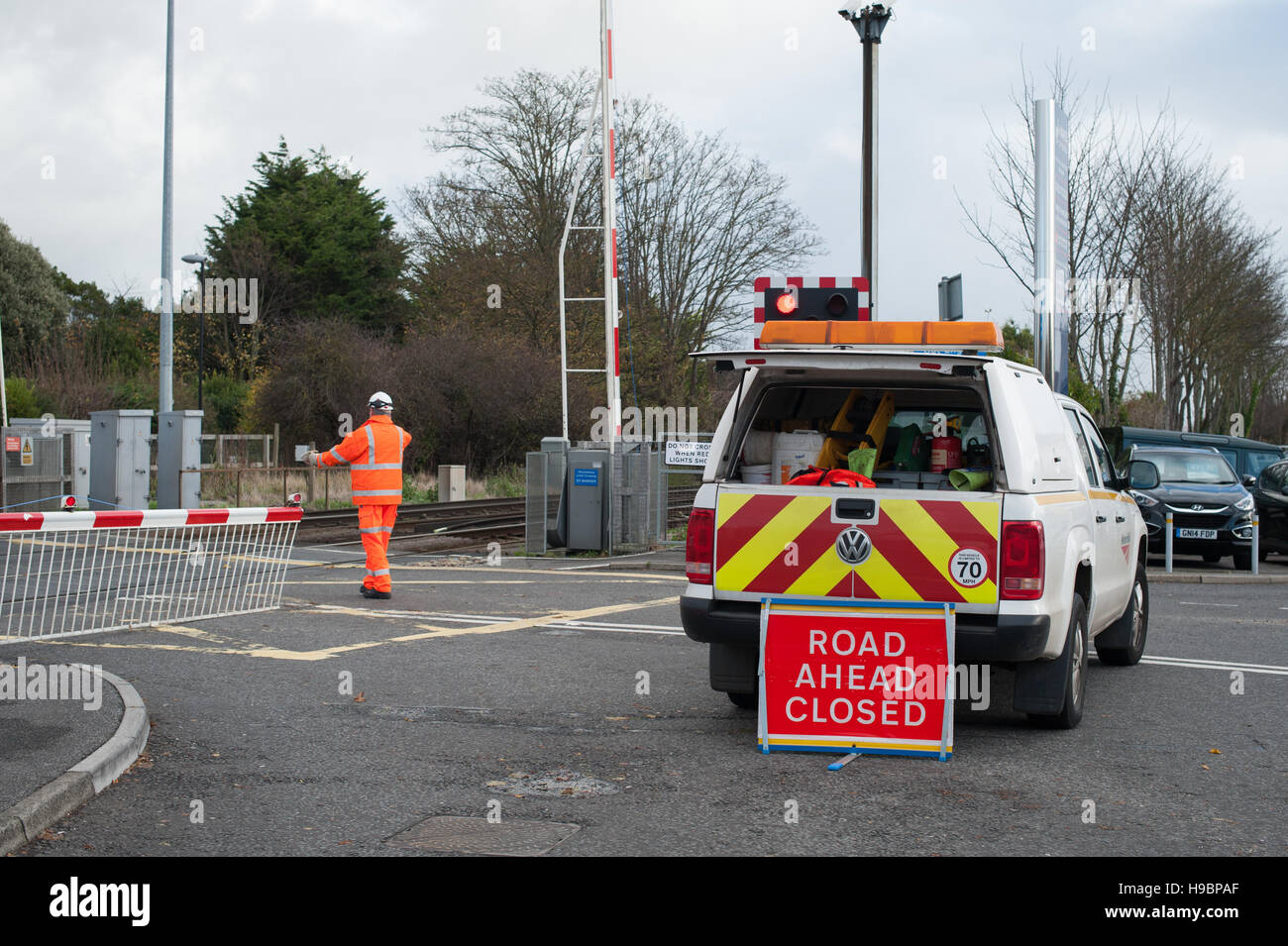 Network Rail engineers repair a railway level crossing barrier after ...