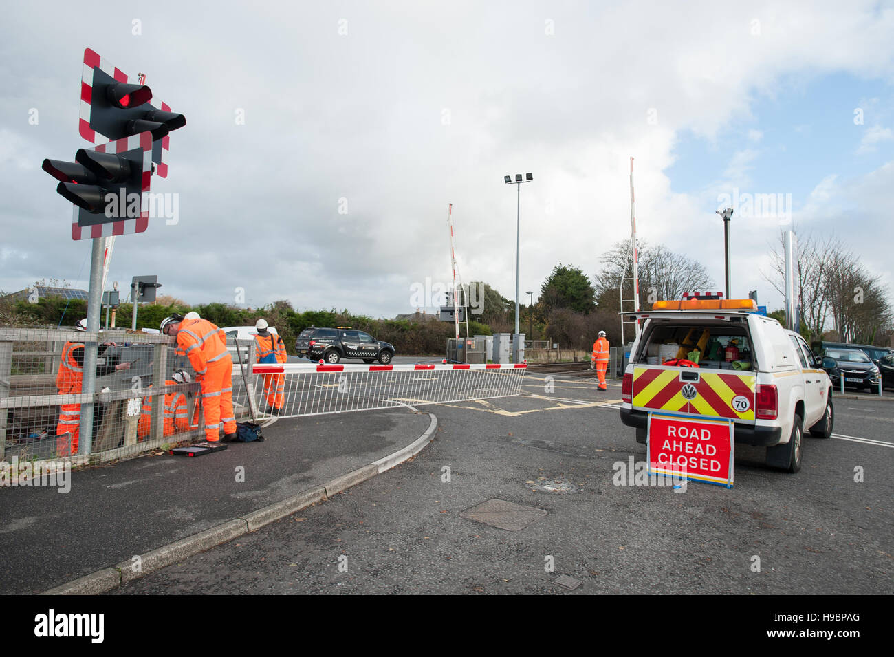 Network Rail engineers repair a railway level crossing barrier after ...