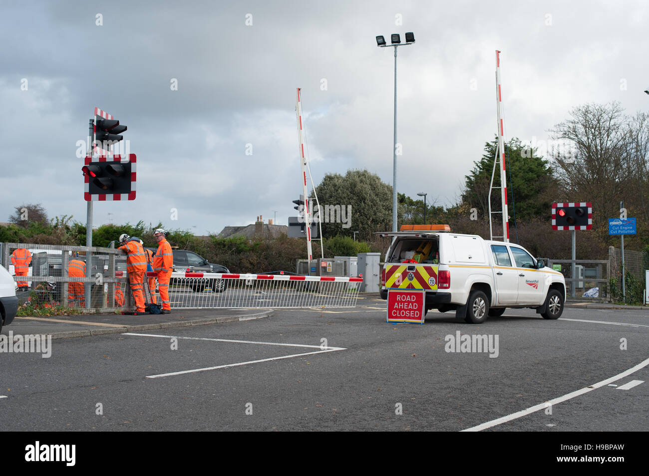 Network Rail engineers repair a railway level crossing barrier after ...