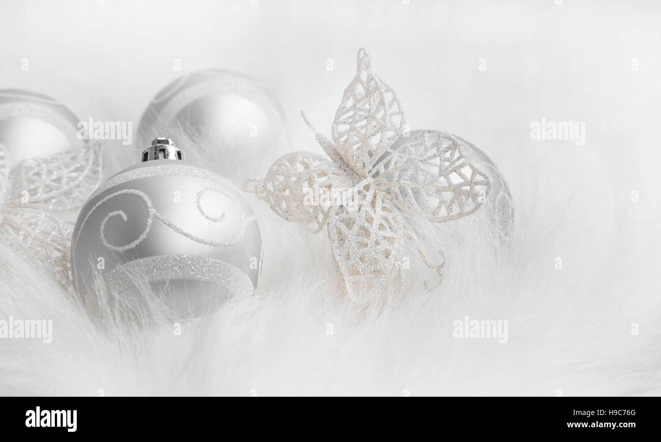Christmas silver festive decorations in white fur Stock Photo - Alamy