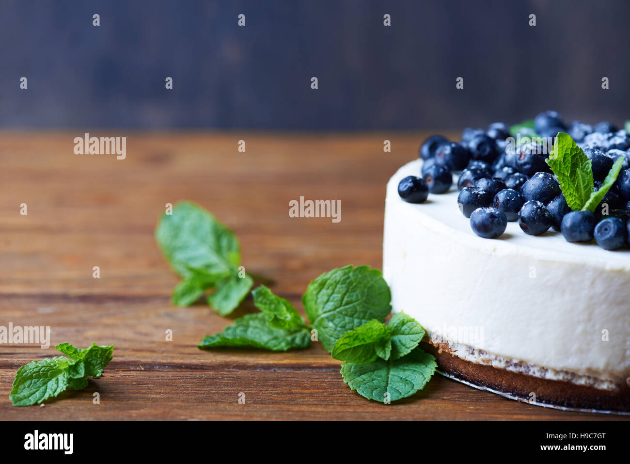 blueberry cheesecake on a wooden background Stock Photo - Alamy