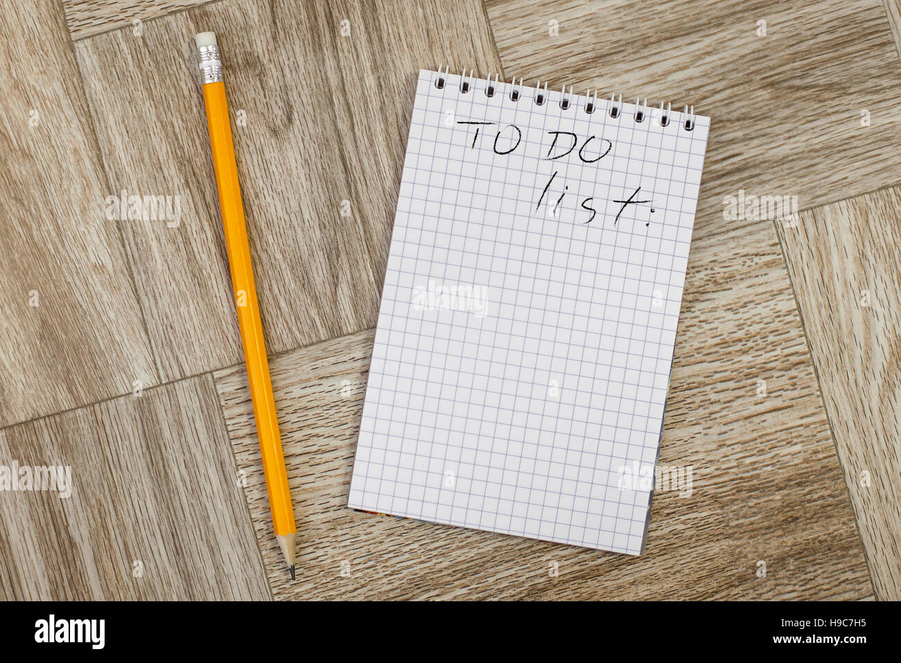 Blank notebook and pencil with todo list Stock Photo - Alamy