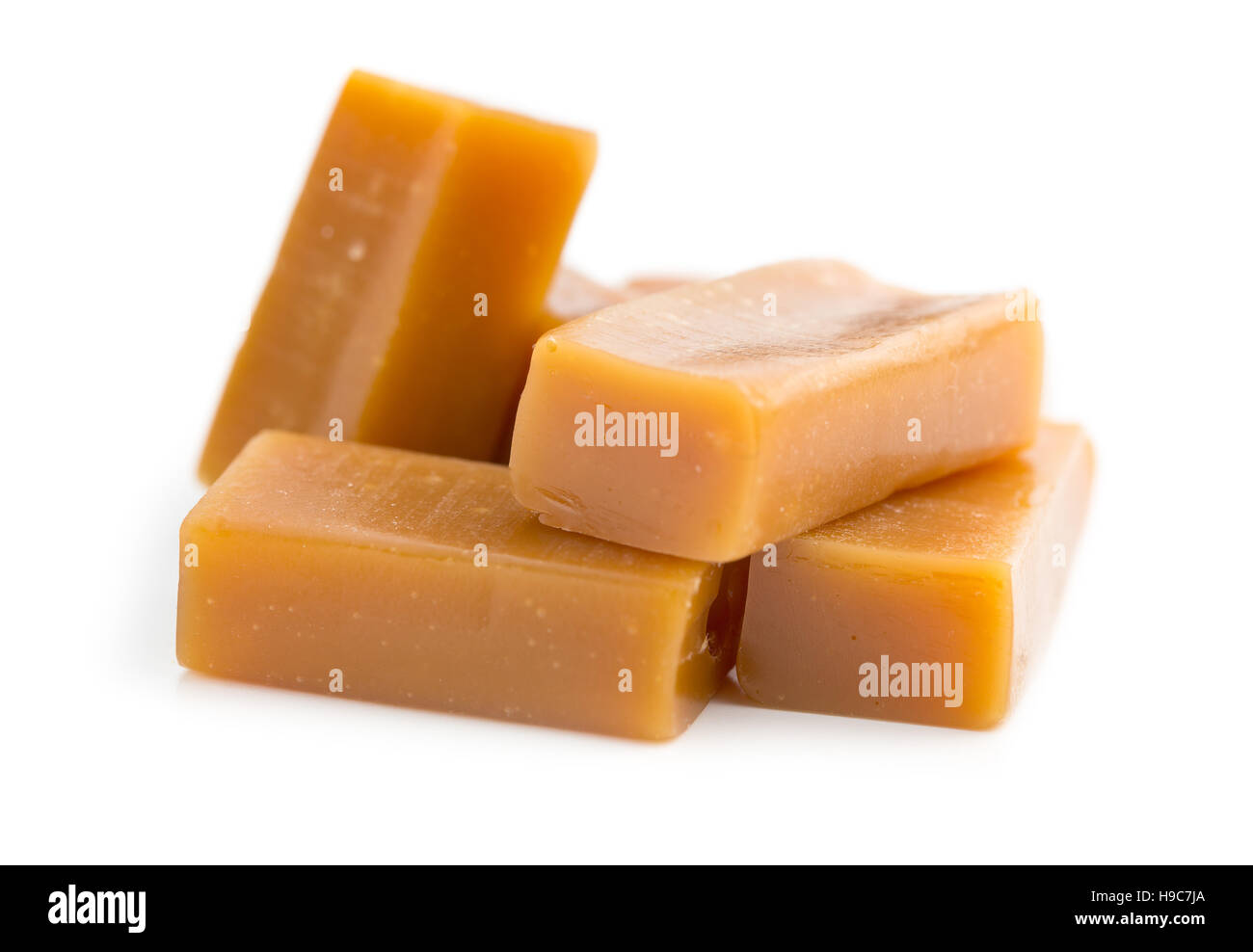 Sweet caramel candies isolated on white background Stock Photo - Alamy