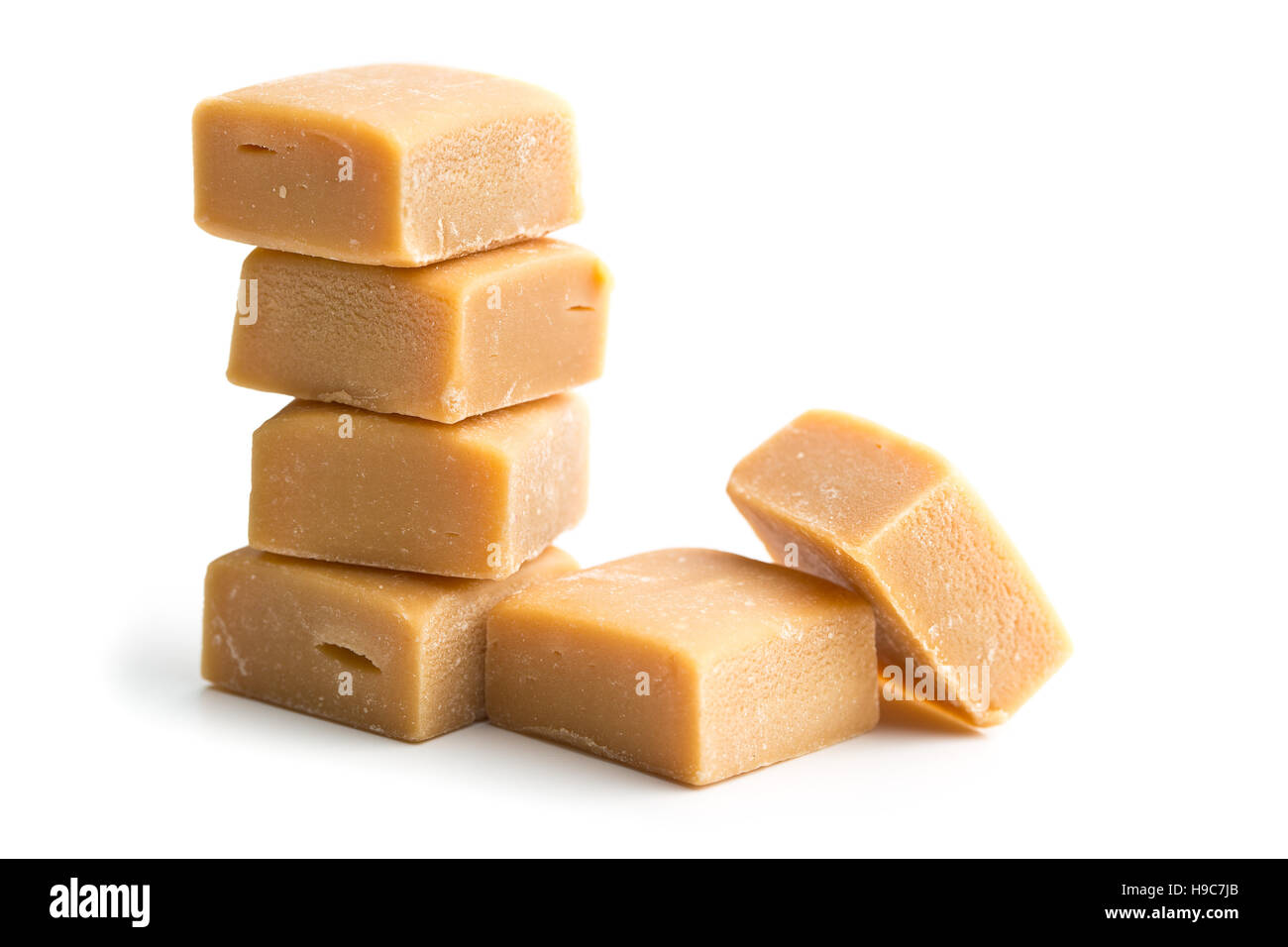 Sweet caramel candies isolated on white background Stock Photo - Alamy