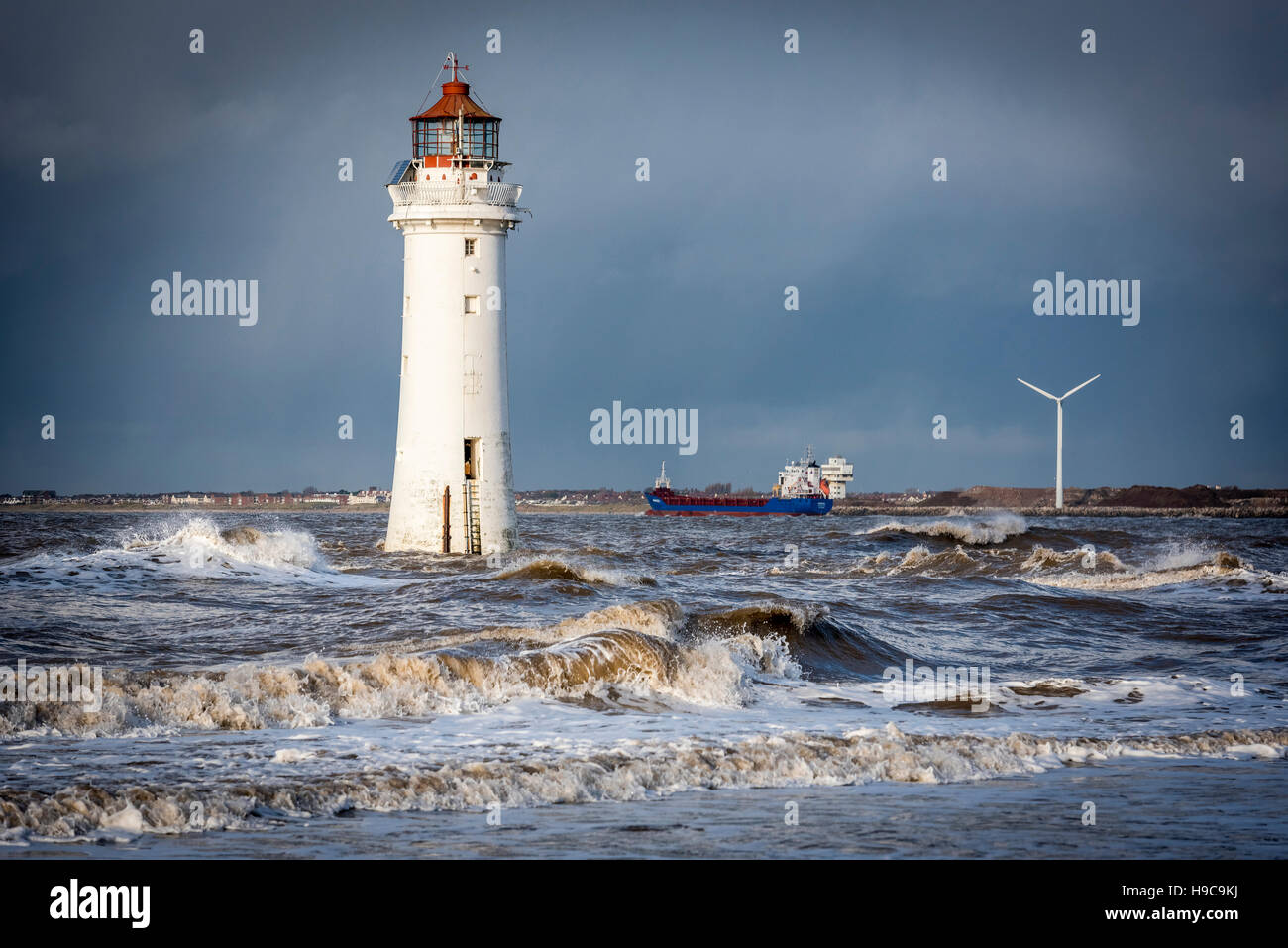 Stormy river Mersey waves crash on the Perch Rock lighthouse at New ...