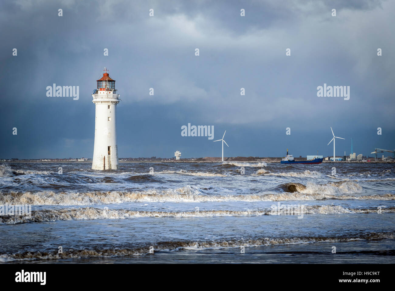 Stormy river Mersey waves crash on the Perch Rock lighthouse at New ...