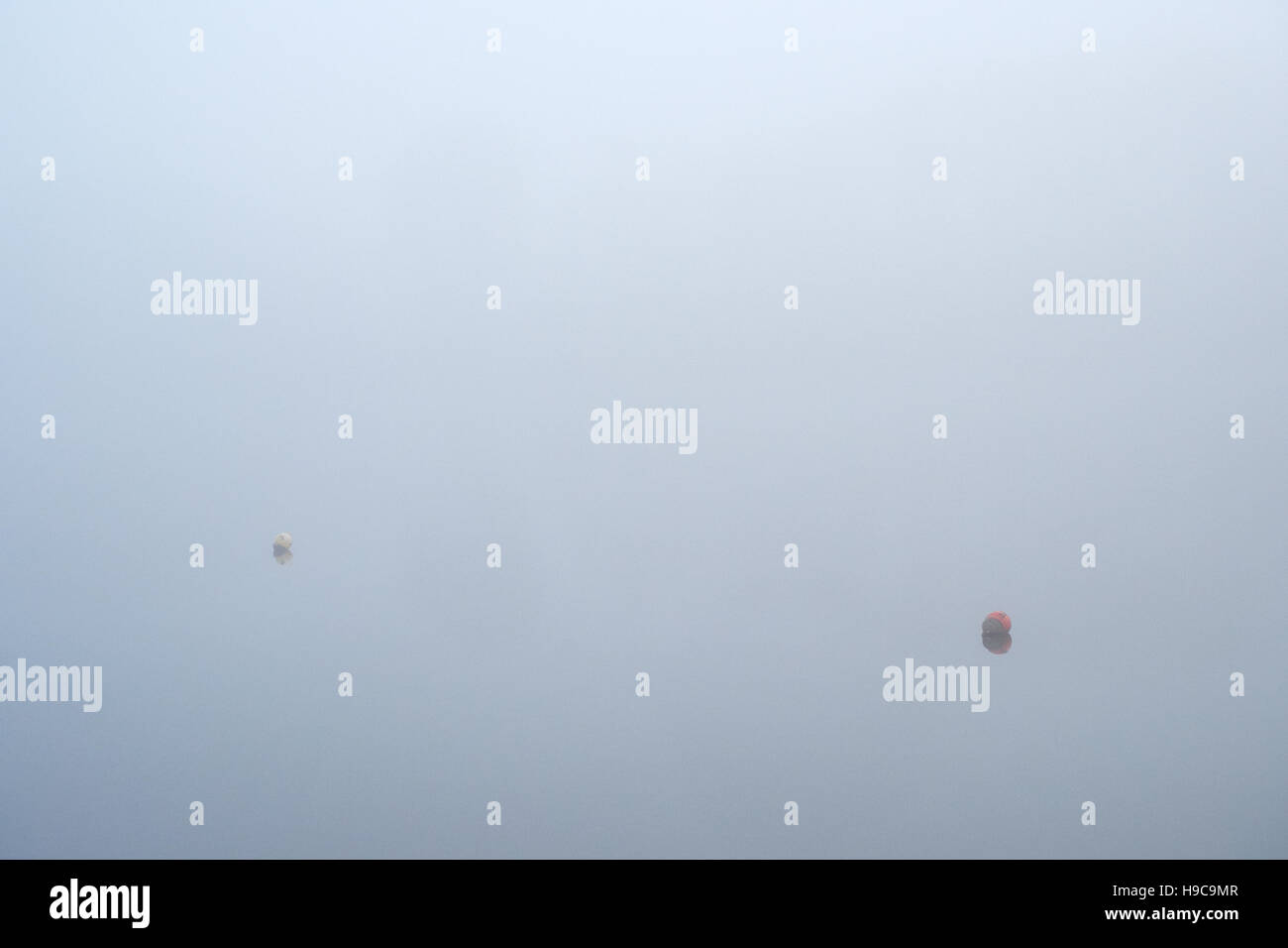 Buoys floating on a lake between Chertsey and Thorpe in Surrey on a ...