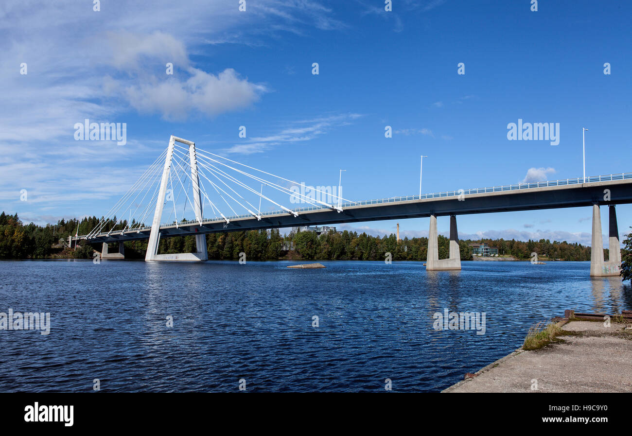 Modern bridge crosses a river. Construction in concrete and steel ...