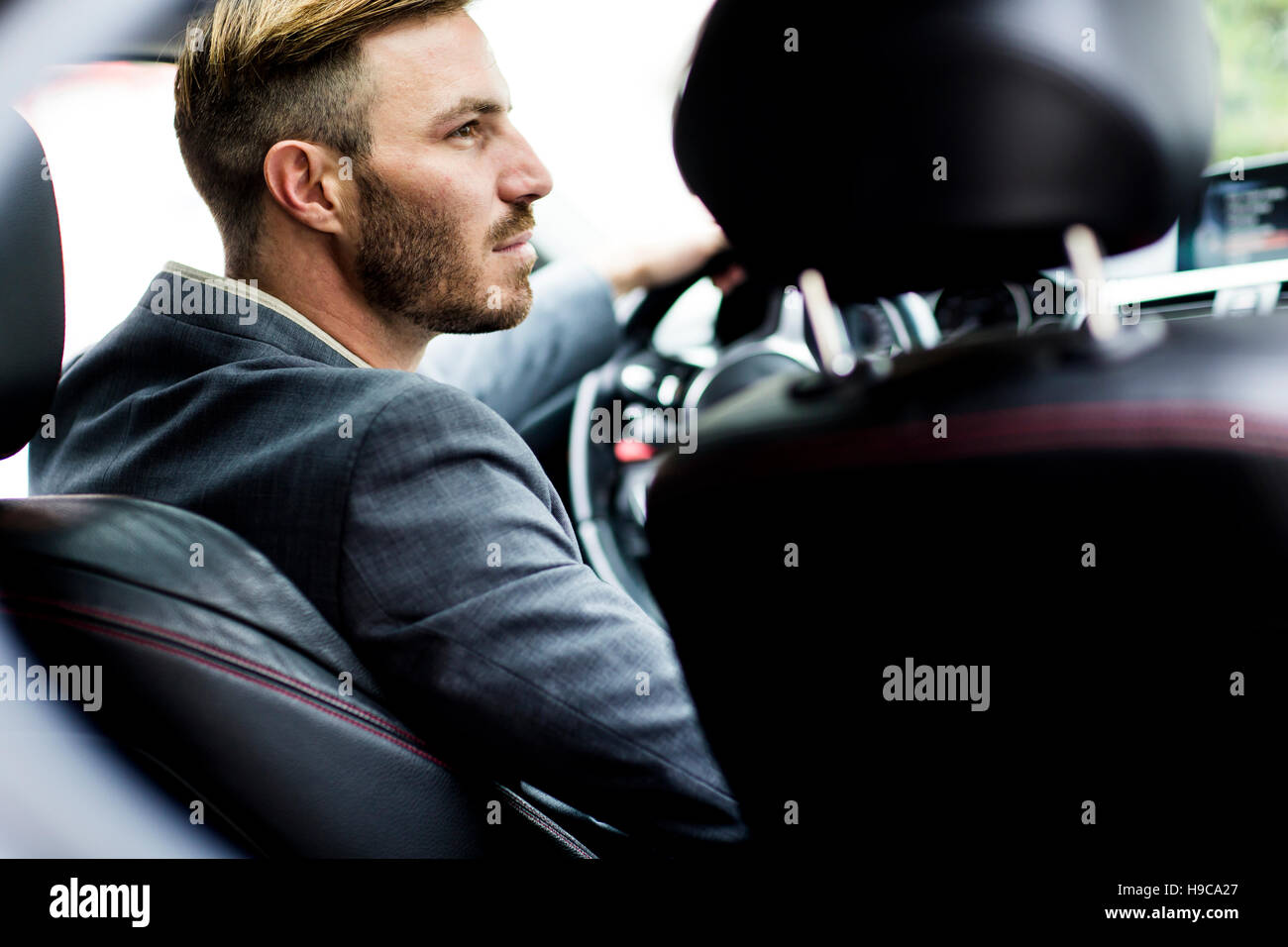 Young man driving in the modern car Stock Photo - Alamy