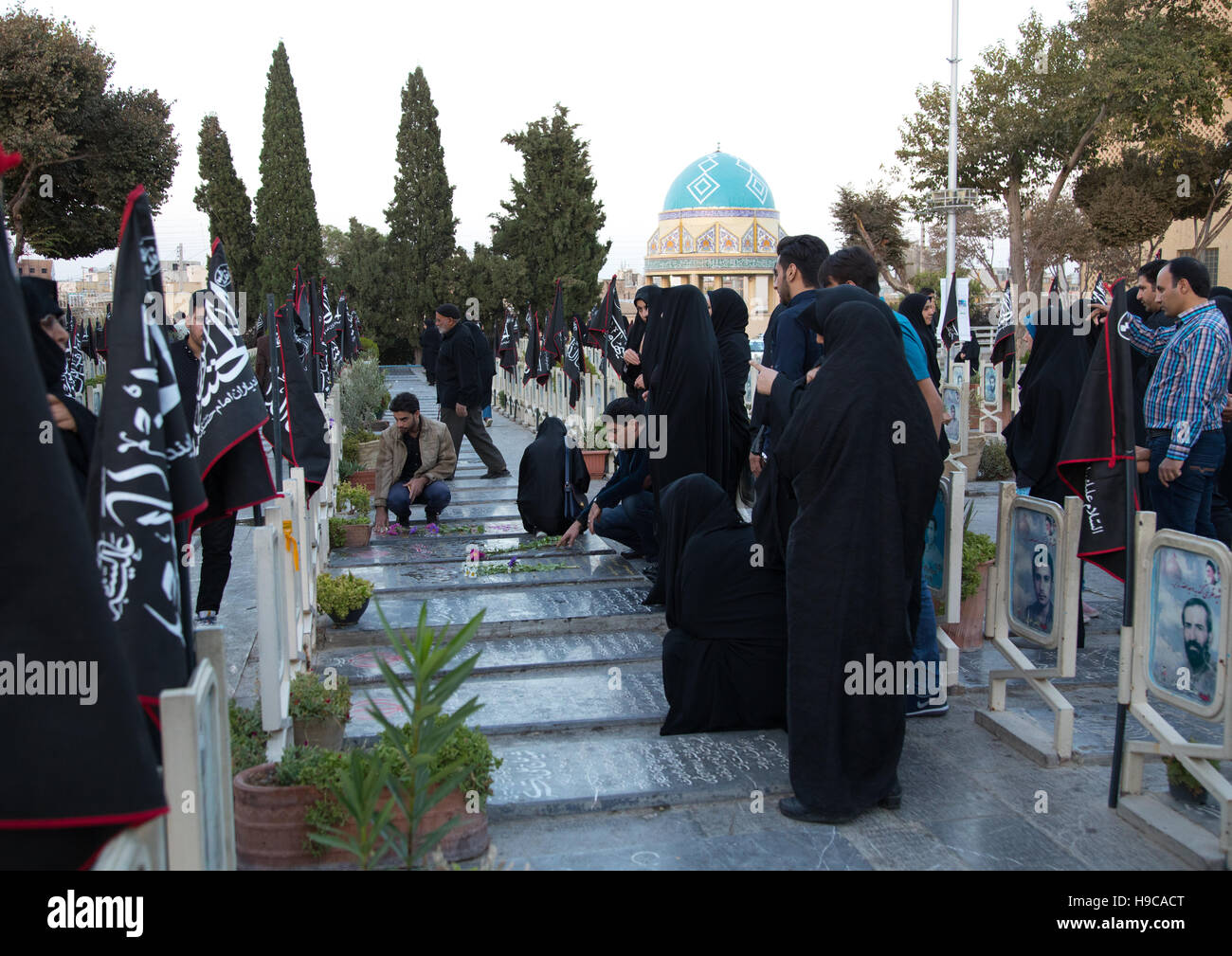 Families praying on the tomb of their sons killed in the iran iraq war ...
