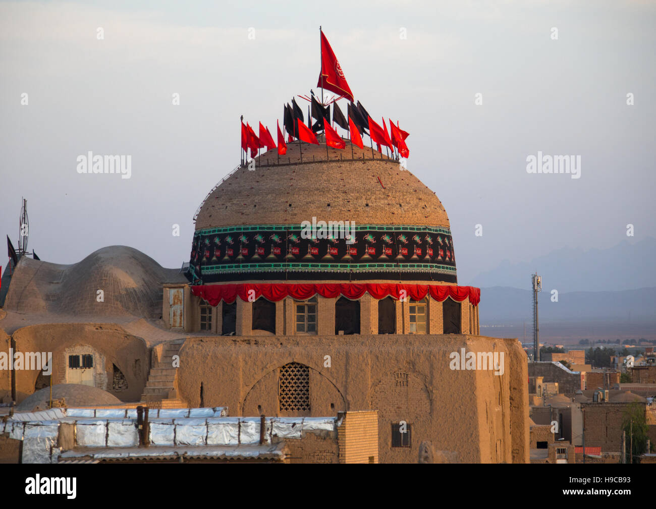 Red and black flags on a shrine decorated for muharram, Isfahan ...