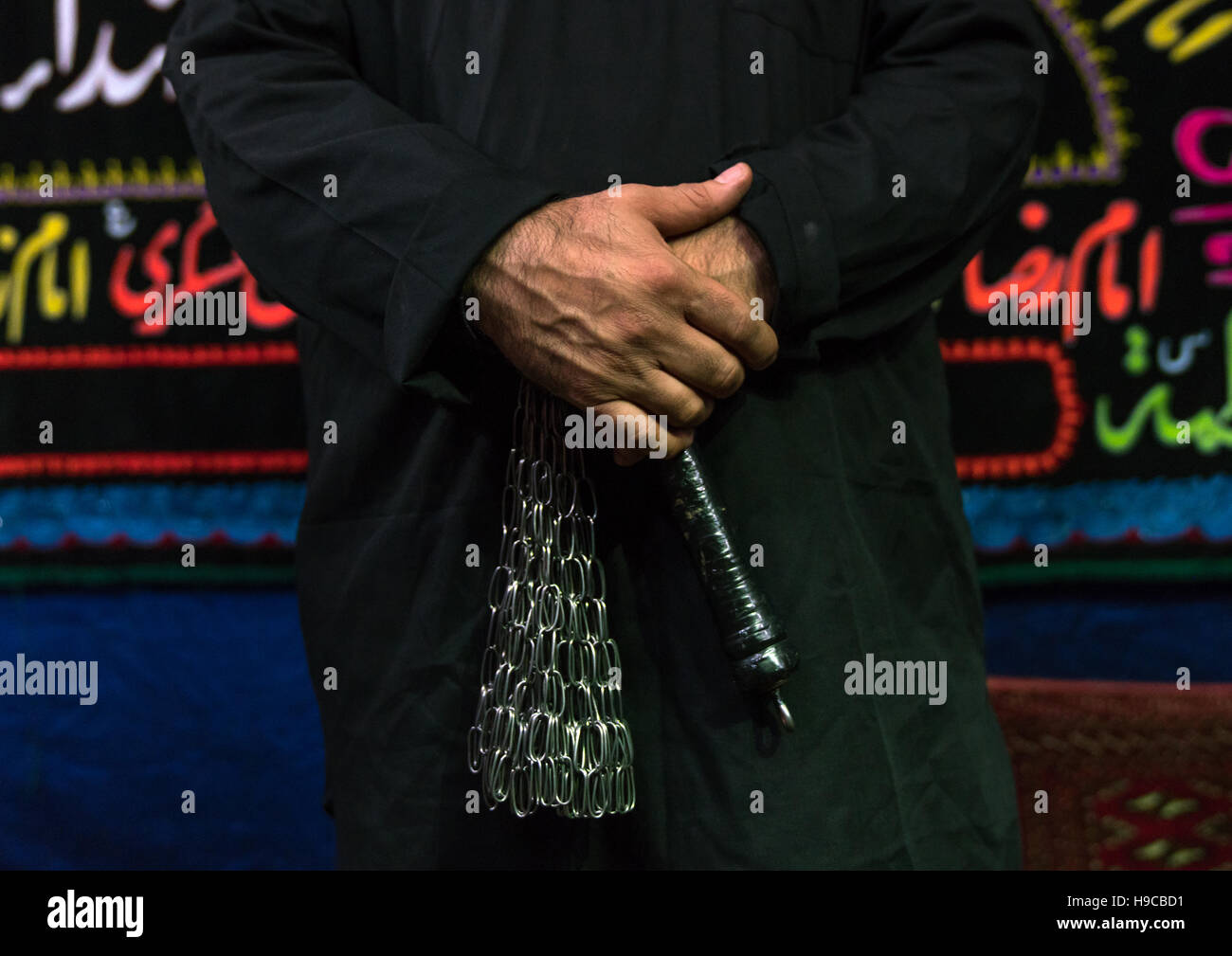 Iranian shiite muslim man with iron chains to commemorate ashura ...