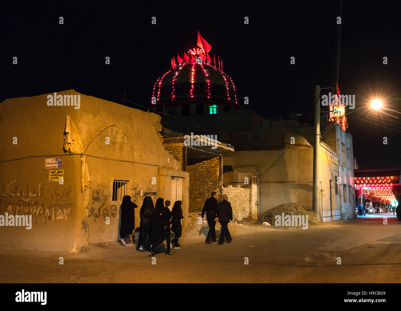 Street decorated and lighten by red lights during muharram to ...