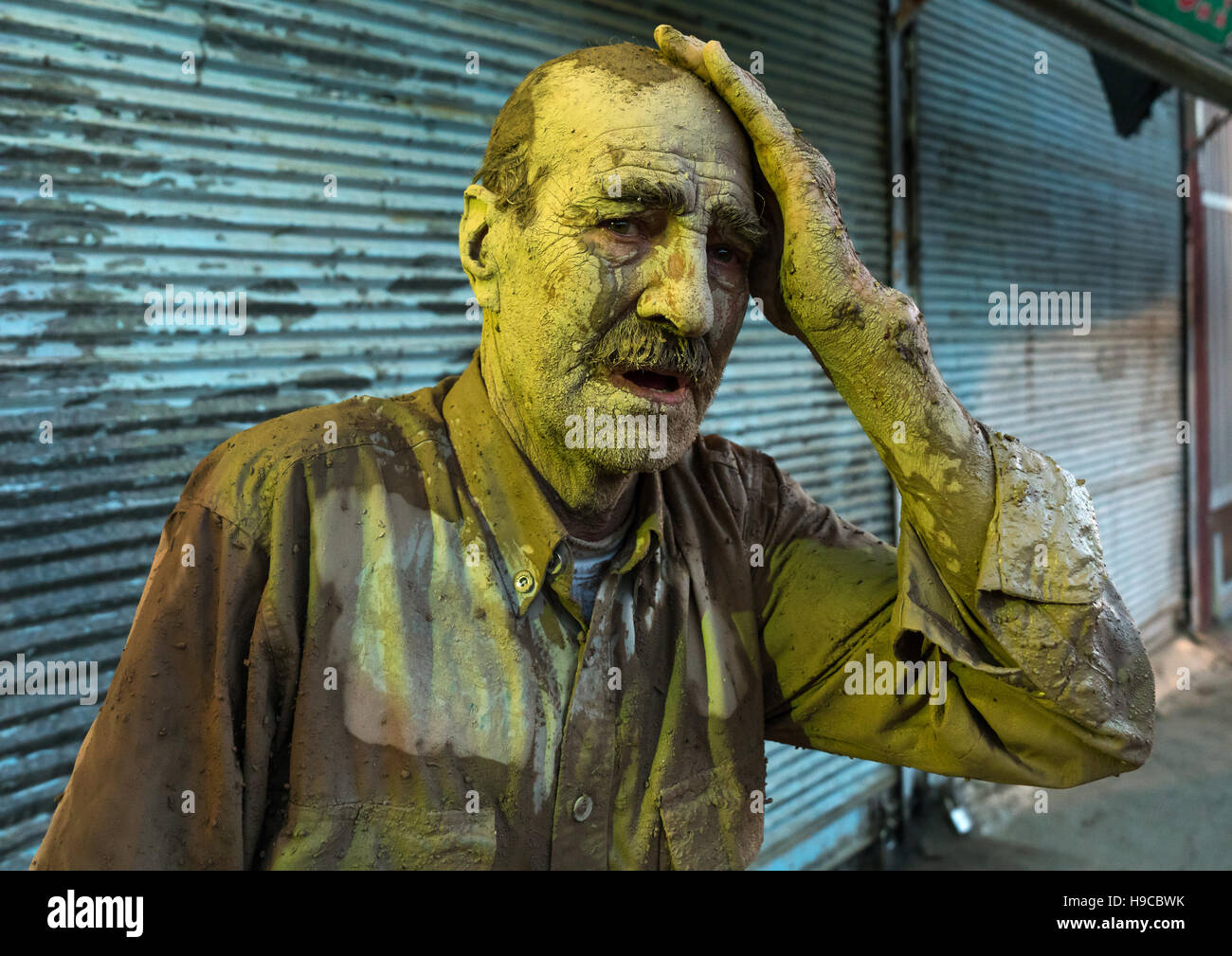 Iranian shiite muslim man crying after rubbing mud on his body during ...