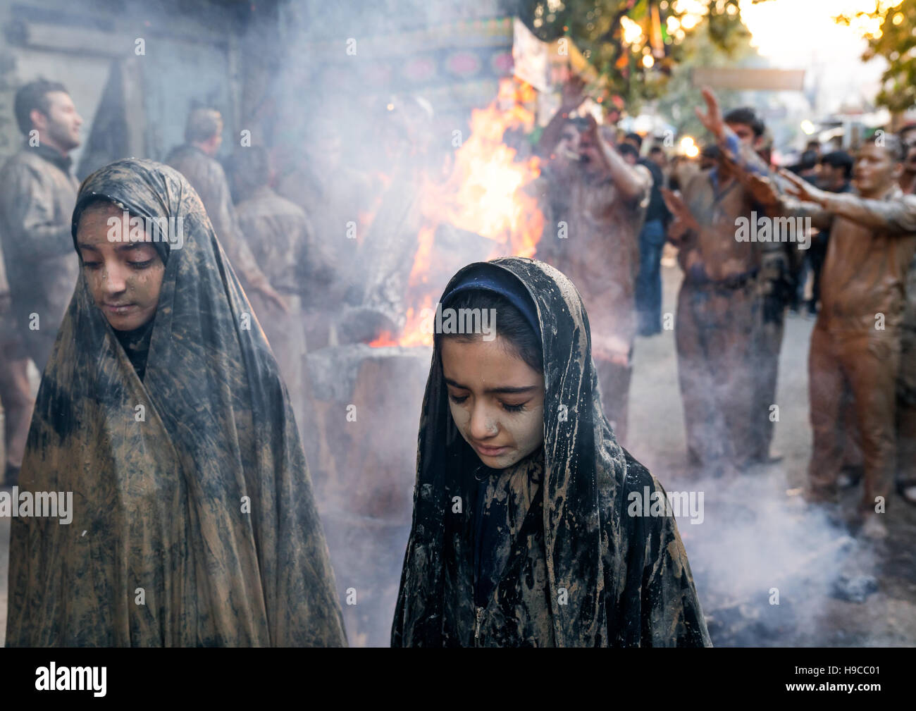 Iranian shiite muslim men and women gather around a bonfire after ...