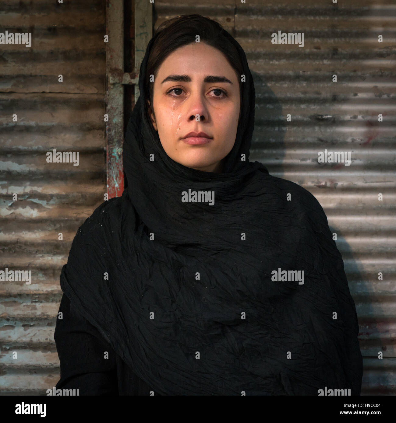 Iranian shiite muslim woman crying during the kharrah mali ritual to ...