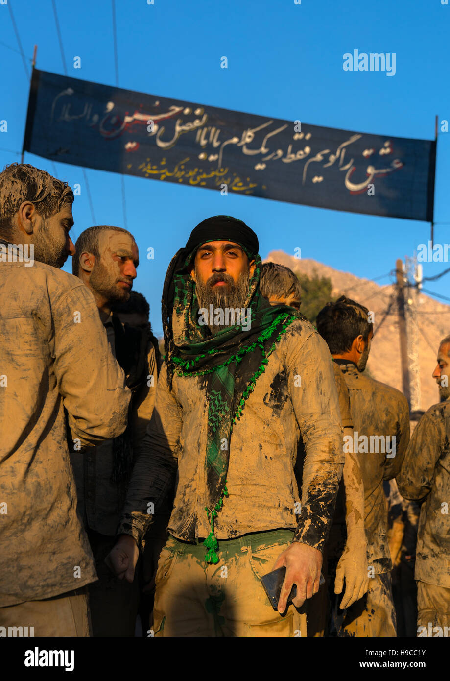 Iranian shiite muslim men gather around a bonfire after rubbing mud on ...