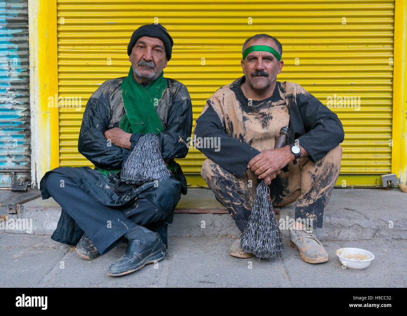Portrait of two iranian shiite muslim men who eat their breakfast after ...