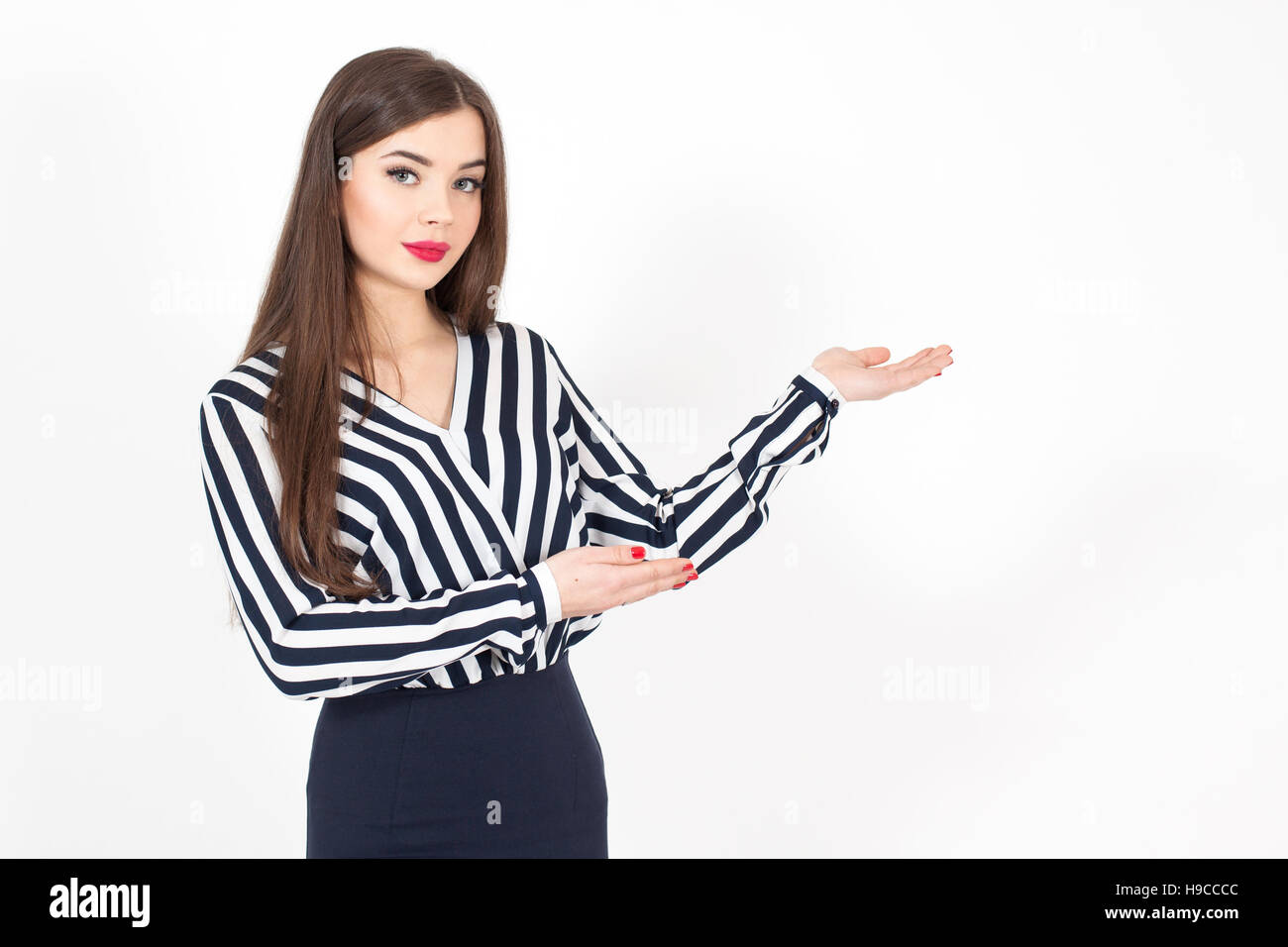 Beautiful elegant Woman showing product .Beautiful girl pointing to the ...