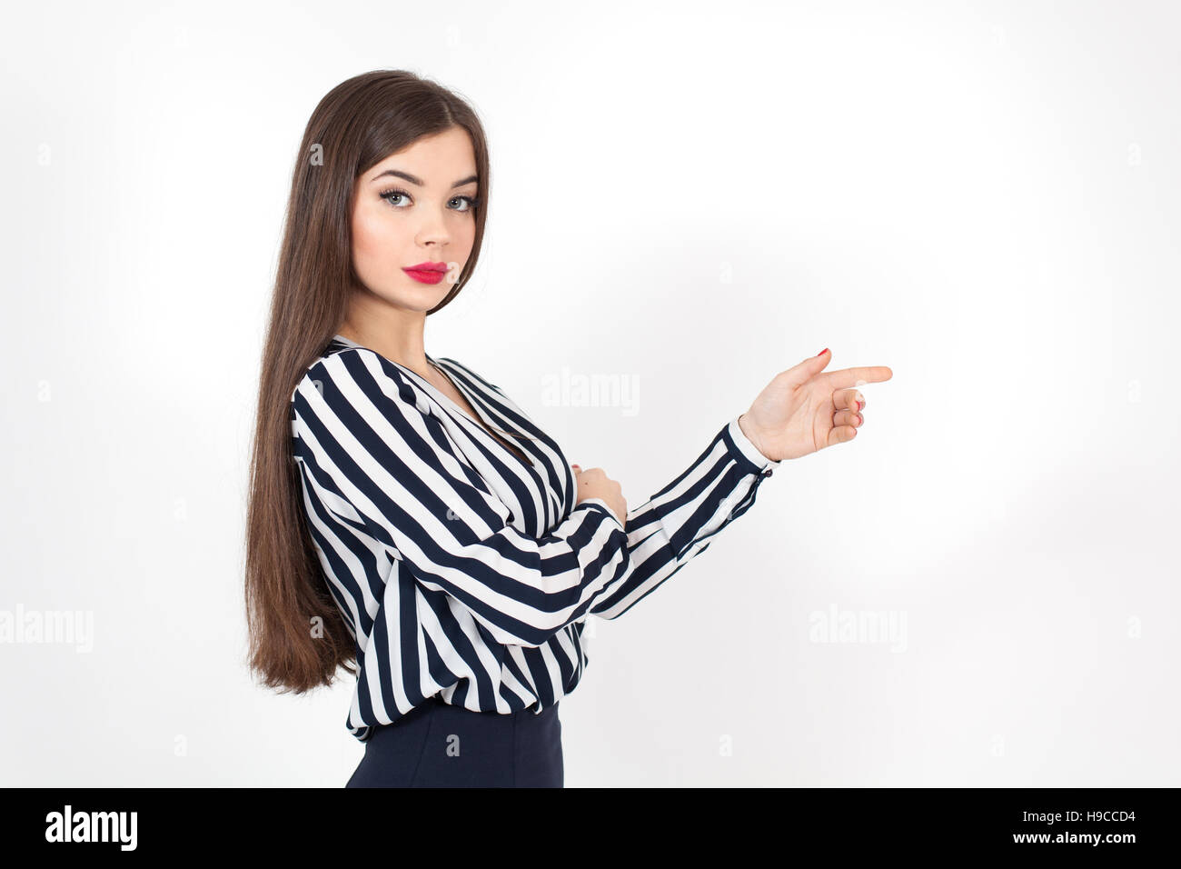 Beautiful elegant Woman showing product .Beautiful girl pointing to the ...