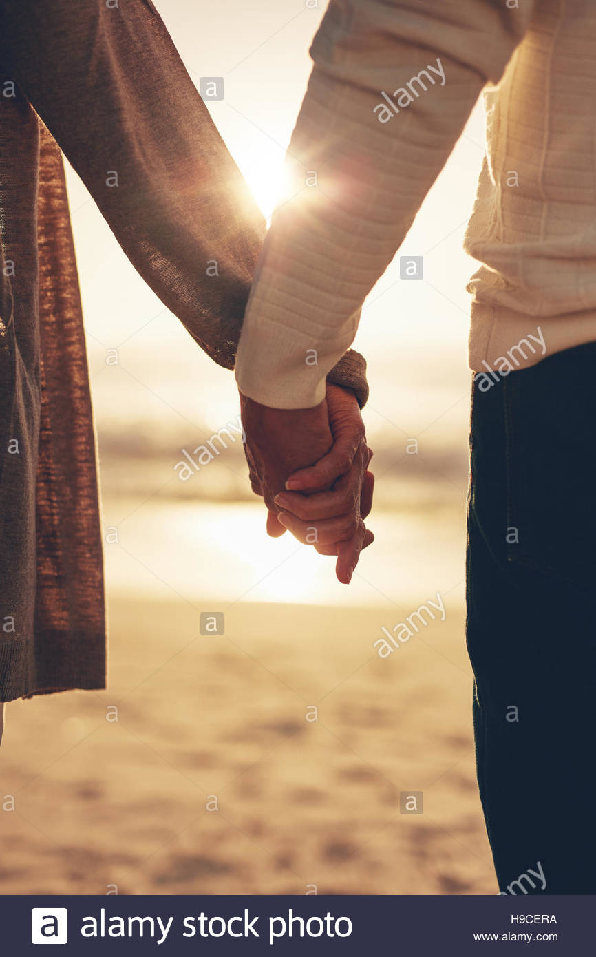 Close Up Two People Holding Hands Stock Photos & Close Up Two People ...