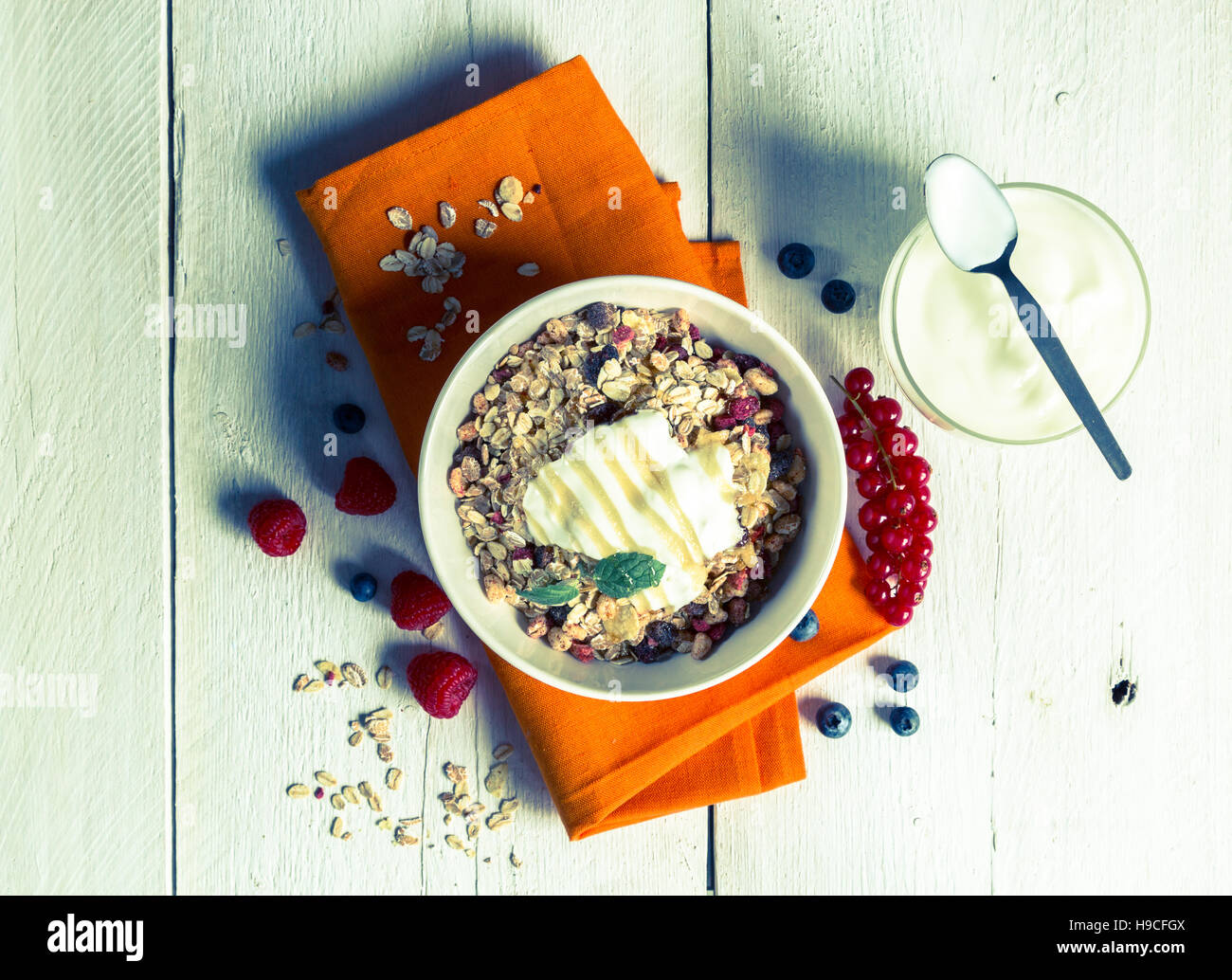 Cereal with yogurt and fruits on wood Stock Photo - Alamy
