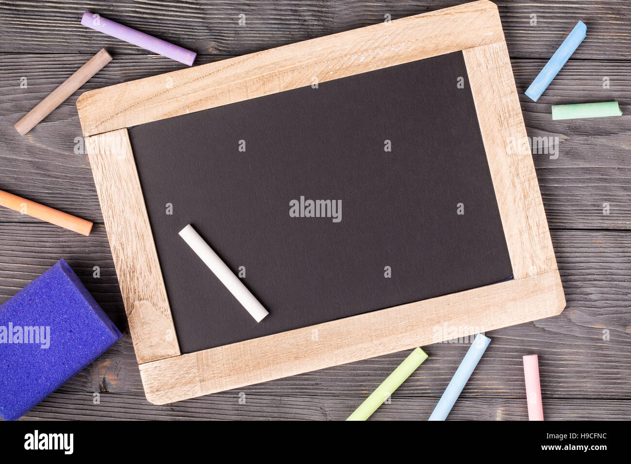 Blackboard purple sponge and white chalk with black copy space Stock ...