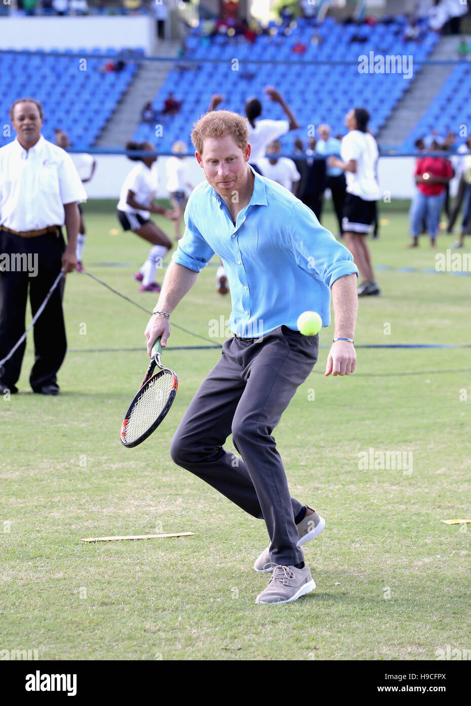 Prince Harry plays tennis as he attends a youth sports festival at the ...