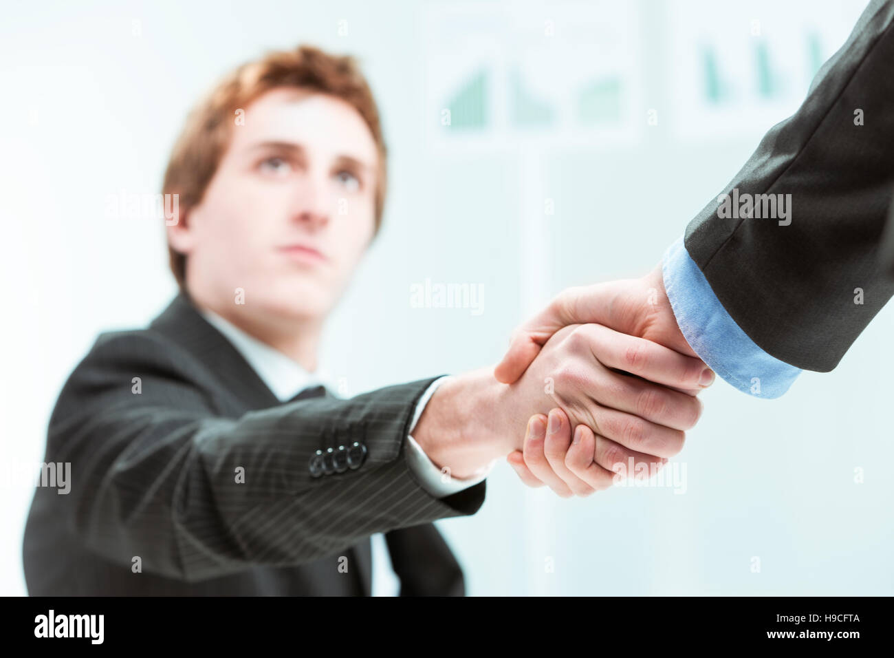 businessmen handshaking with hands in focus and blurred man face Stock ...