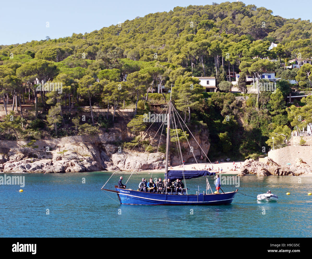 Boat full of divers heading out from Tamariu, Spain, Catalonia Stock ...