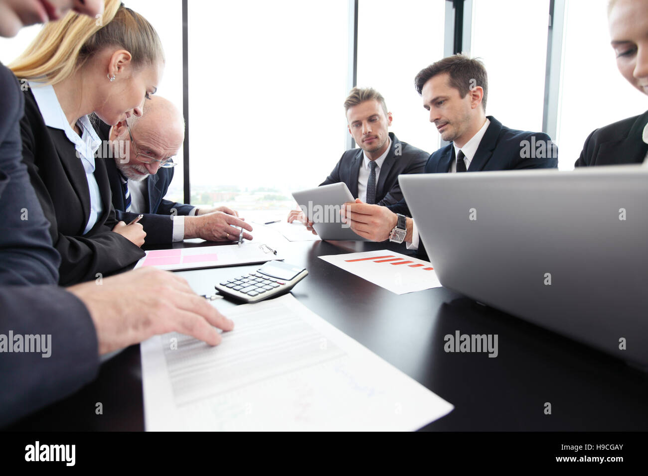 Group of business people working with documents and computers Stock ...