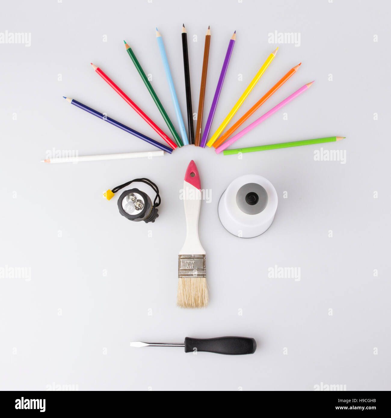 Desk of an artist with lots stationery objects. Studio shot on white ...