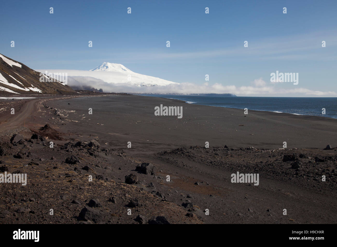 Black sand beach and snow covered Beerenberg volcano ( 2,277m) on Jan ...