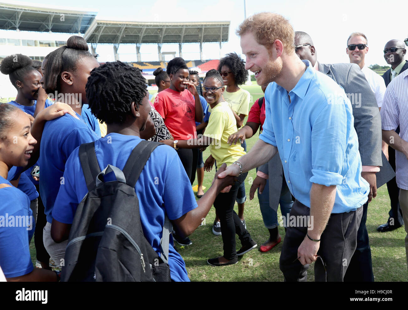 Prince Harry meets school girls as he attends a youth sports festival ...