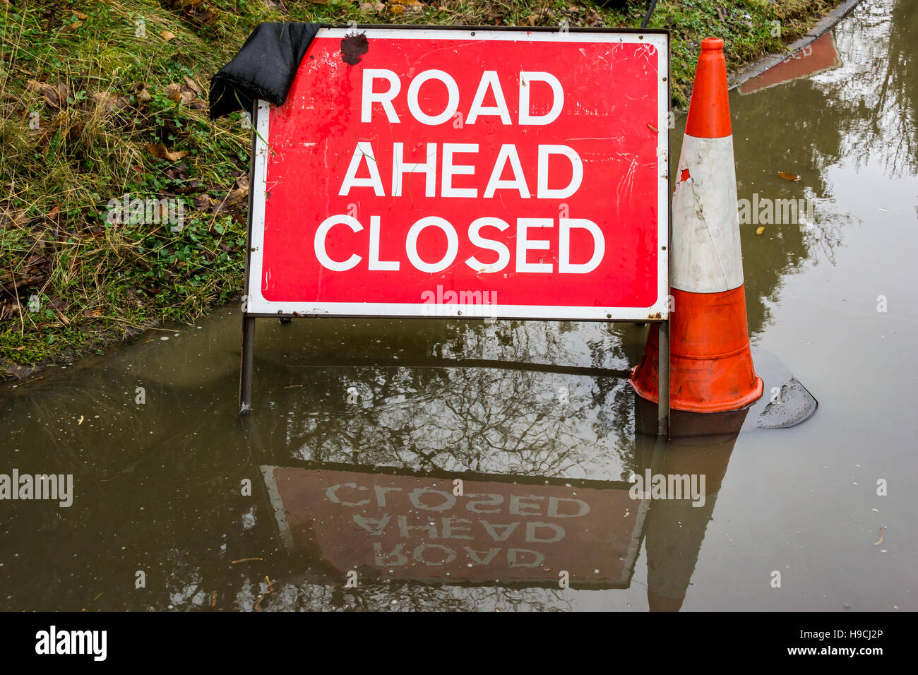 Road Ahead Closed Sign Standing in Flood water Stock Photo - Alamy