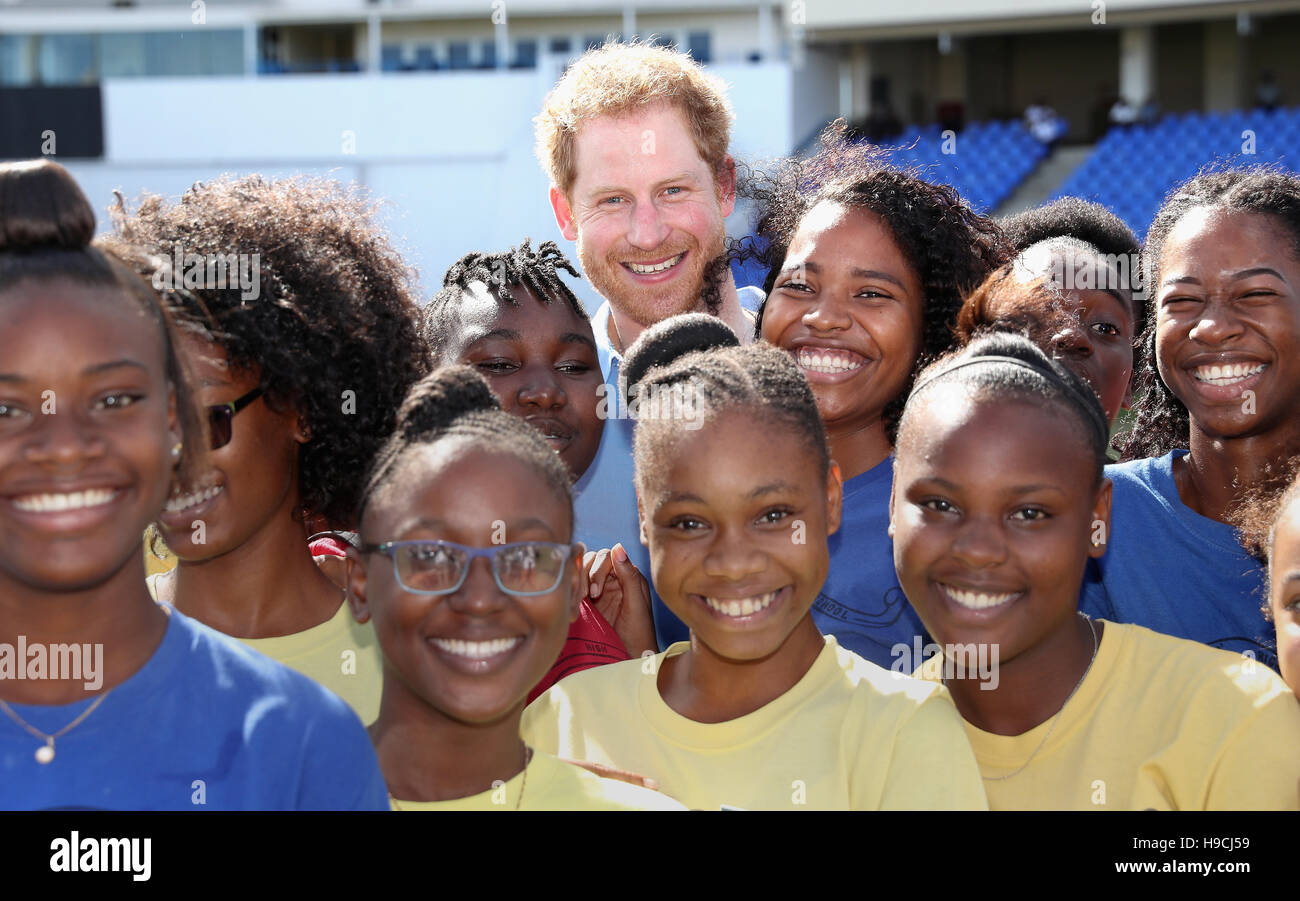 Prince Harry meets school girls as he attends a youth sports festival ...