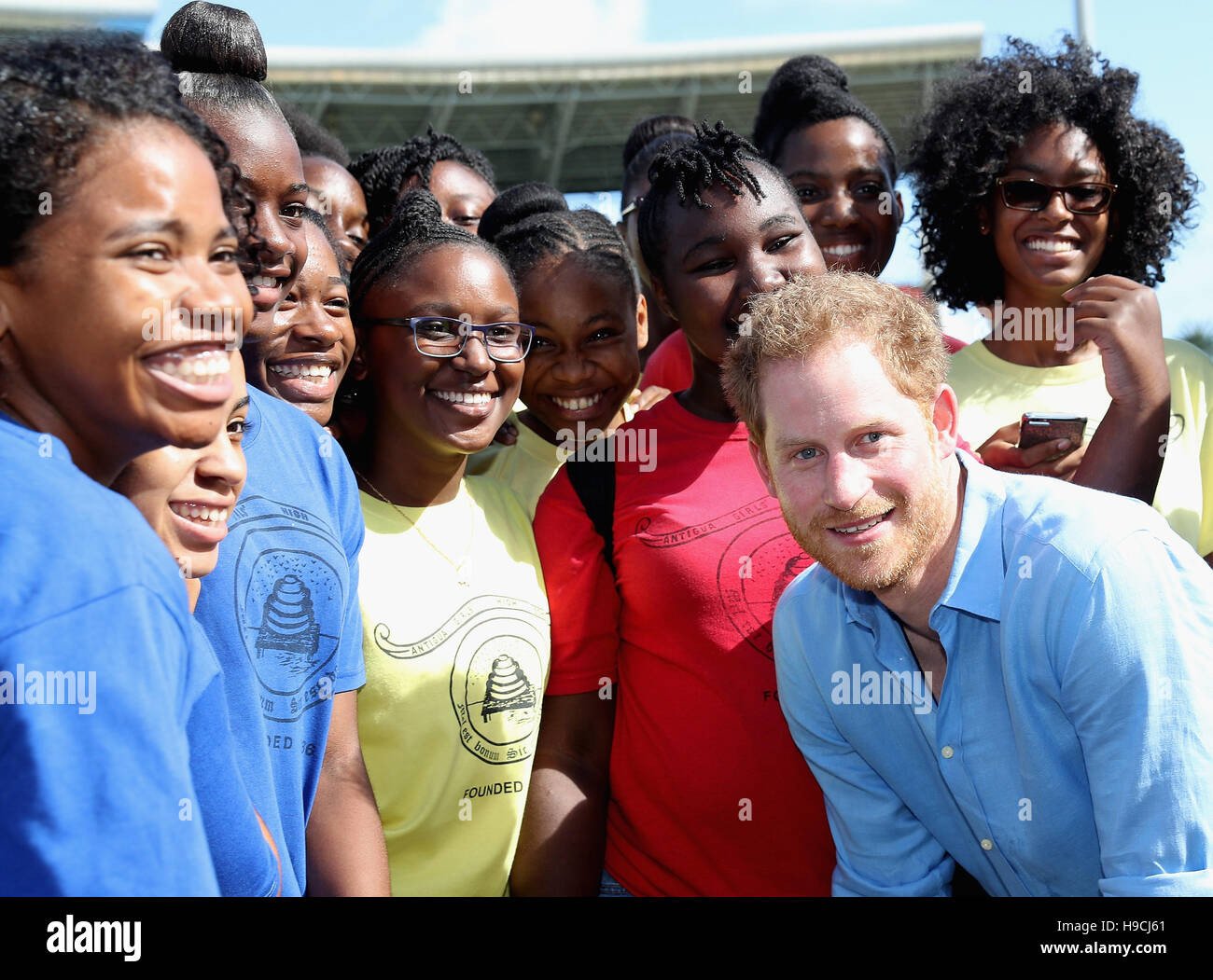 Prince Harry meets school girls as he attends a youth sports festival ...